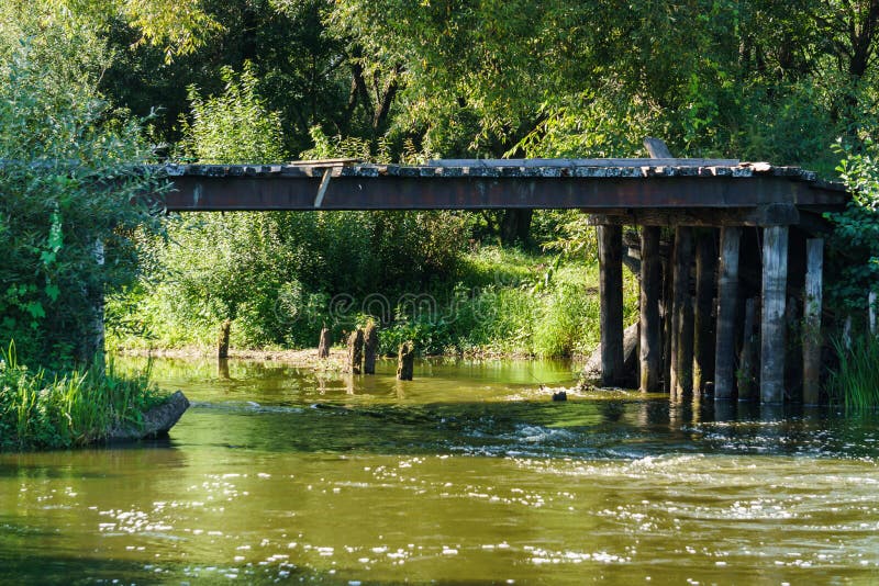 Old Dilapidated Wooden Bridge Over the River. Stock Photo - Image of ...