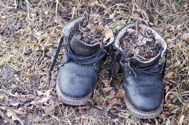 Old Dirty Boots Shoe with Leaves and Soil Stock Photo - Image of ...