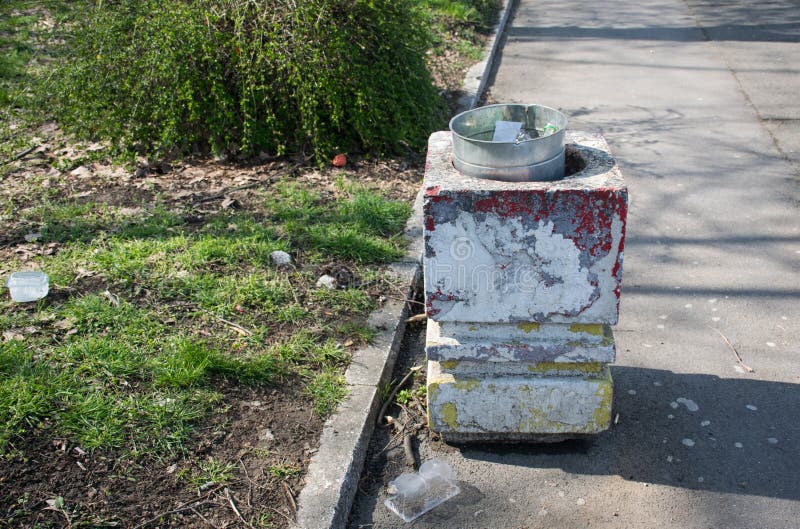 Old and Dirty Concrete Trash Can, on Walking Area in the City, Garbage ... Old and Dirty Concrete Trash Can, on Walking Area in the City, Garbage ...
