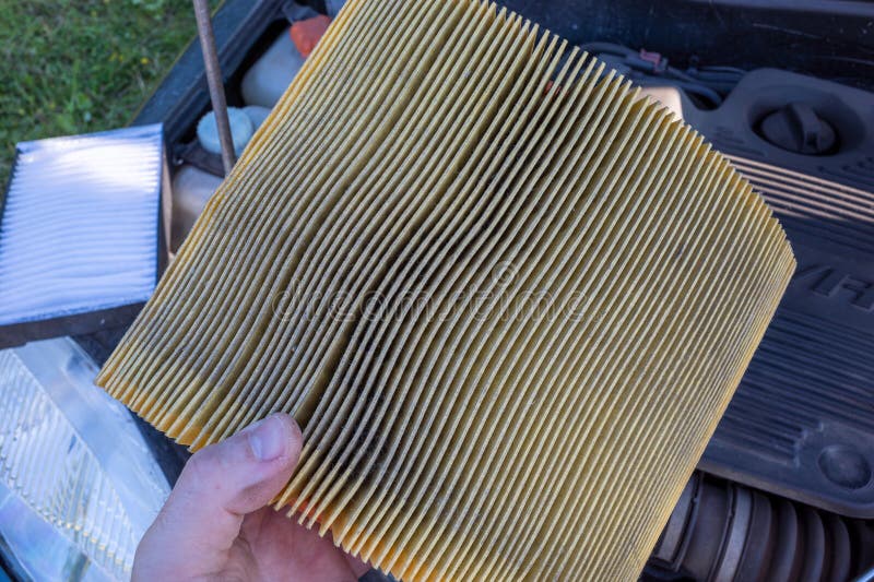 An Old Dirty Engine Filter in the Hands of an Auto Mechanic ...