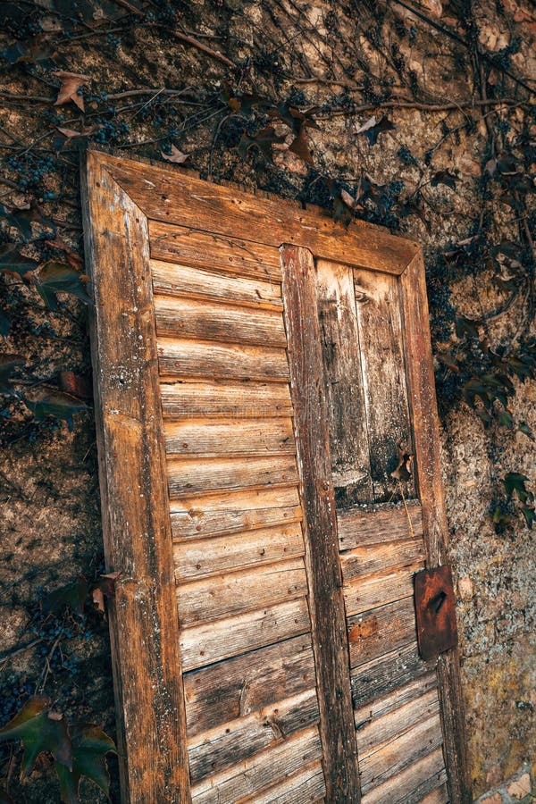 Old Discarded Wooden Door Leaning Against the Brick Wall Stock Photo ...
