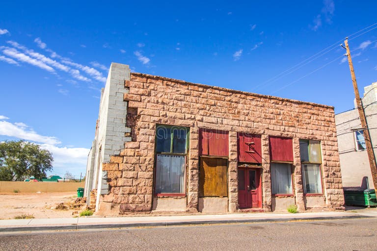Old Distressed Brick Commercial Store Front Building with Boarded Up ...