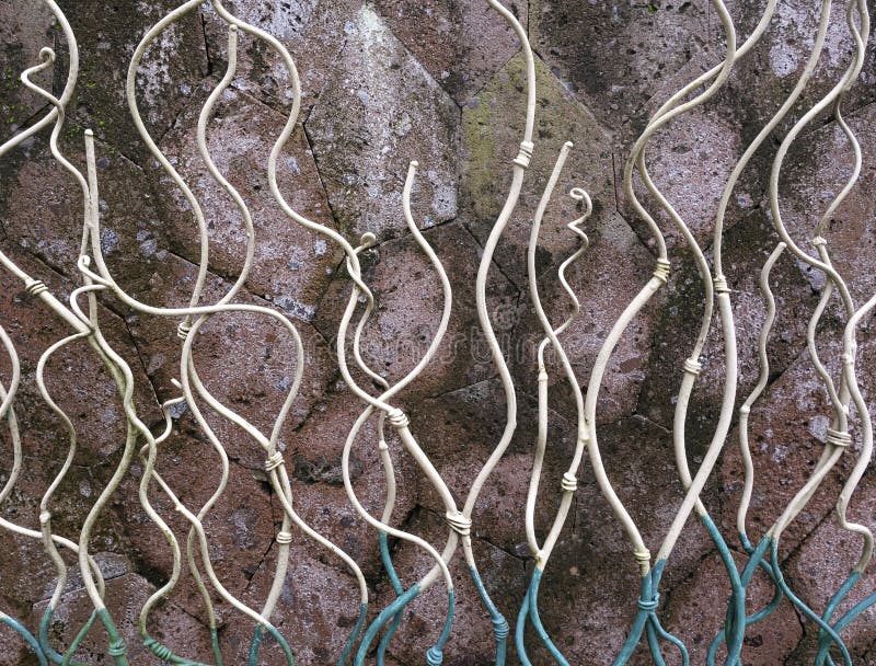 Distressed Concrete Wall with White and Blue Wavy Wire Design ...