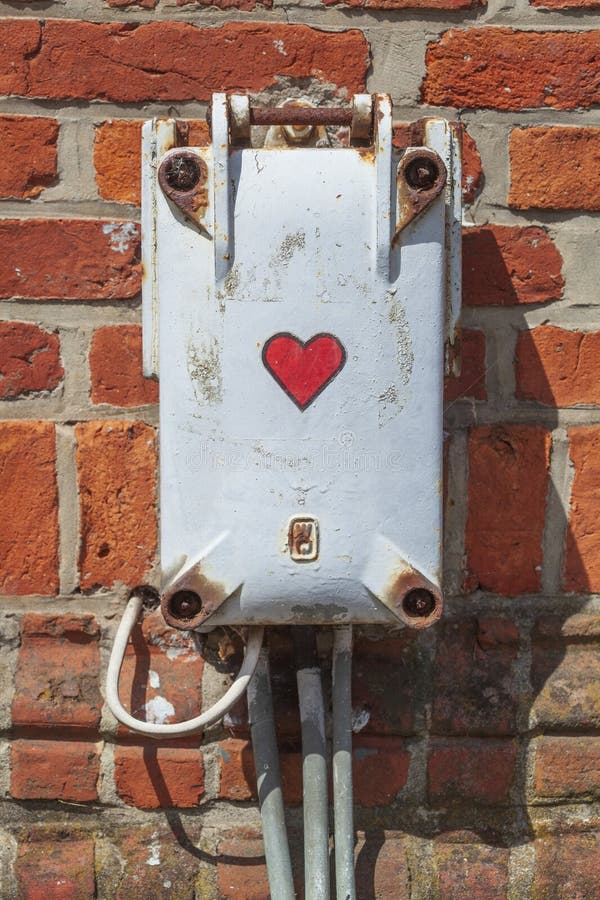 Old Distribution Box and Red Heart on a House Wall, Electricity ...