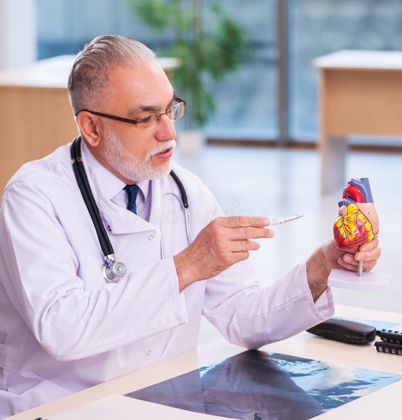 Old Male Doctor Cardiologist Working in the Clinic Stock Photo - Image ...
