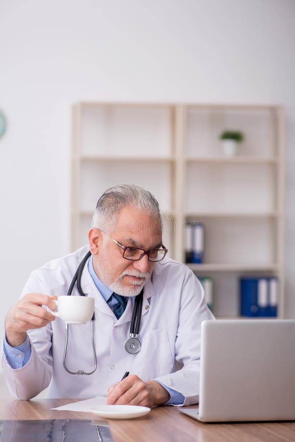 Old Male Doctor Drinking Coffee during Break Stock Image - Image of ...