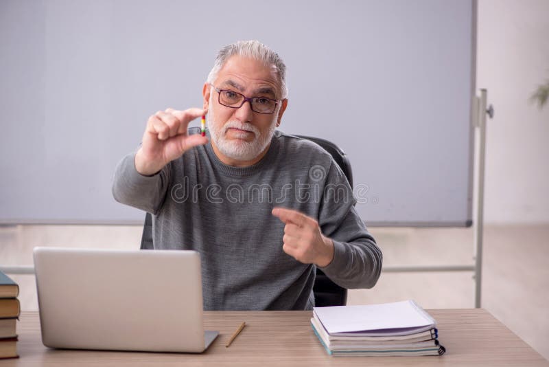 Old Male Doctor Feeling Bad in the Classroom Stock Photo - Image of ...