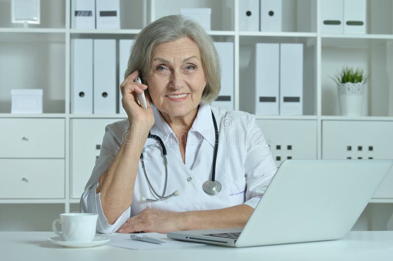 Old Doctor with a Laptop Working Stock Photo - Image of attractive ...
