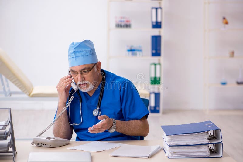 Old Male Doctor Working in the Clinic Stock Image - Image of checkup ...
