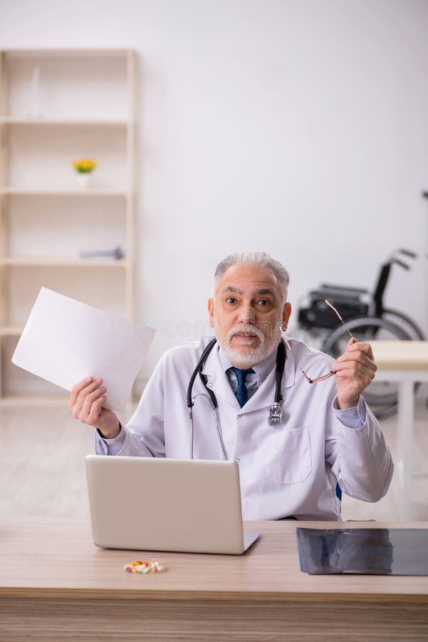 Old Male Doctor Working in the Clinic Stock Photo - Image of illness ...