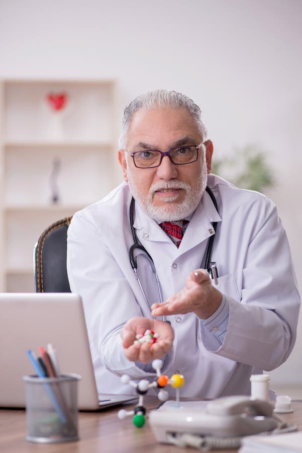 Old Male Doctor Working in the Clinic Stock Photo - Image of doctor ...