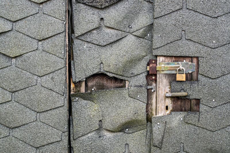Old Door with Tar Paper and Lock on a Boathouse Stock Photo - Image of ...
