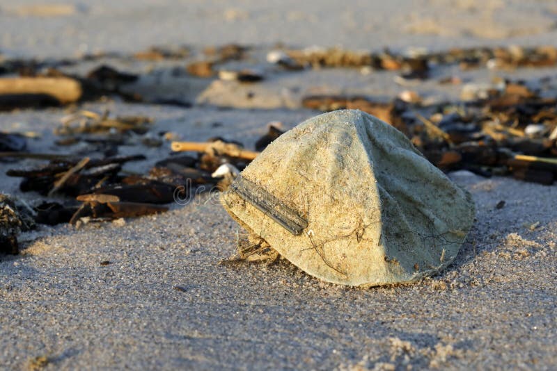 Old Dust Mask Washed Ashore on a Beach Stock Photo - Image of ...