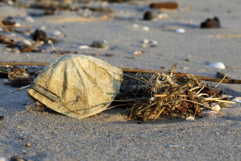 Old Dust Mask Washed Ashore on a Beach Stock Image - Image of dump ...
