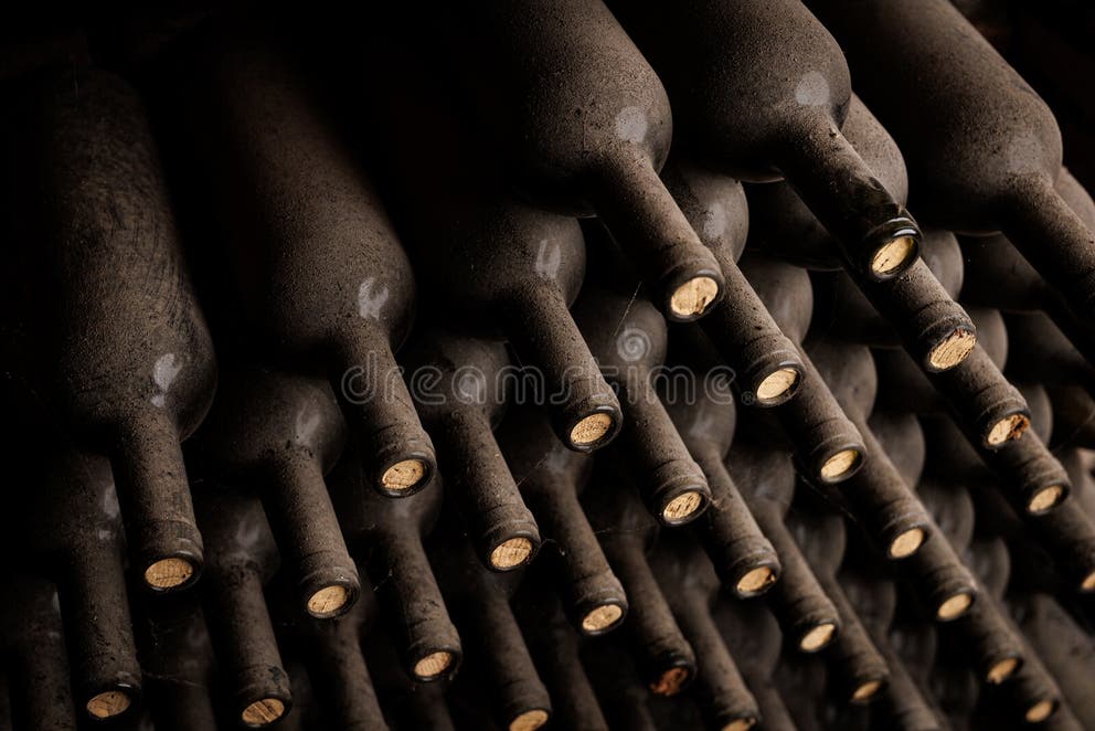 Old Dusty Bottles of Wine are Left on Top of Each Other in the Cellar ...