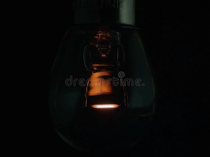 Old Dusty Light Bulb Glowing in the Dark Stock Image - Image of wire ...