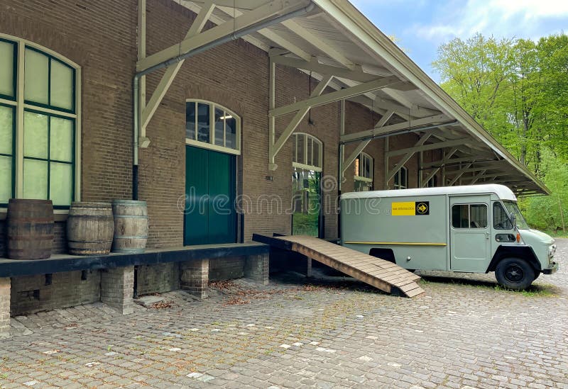 Old Dutch Transport Company with Bus and Loading Dock Stock Image ...