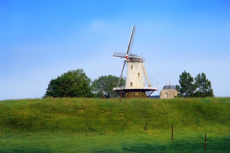 Old Dutch Windmill on a Dike. Stock Image - Image of heritage, spinning ...