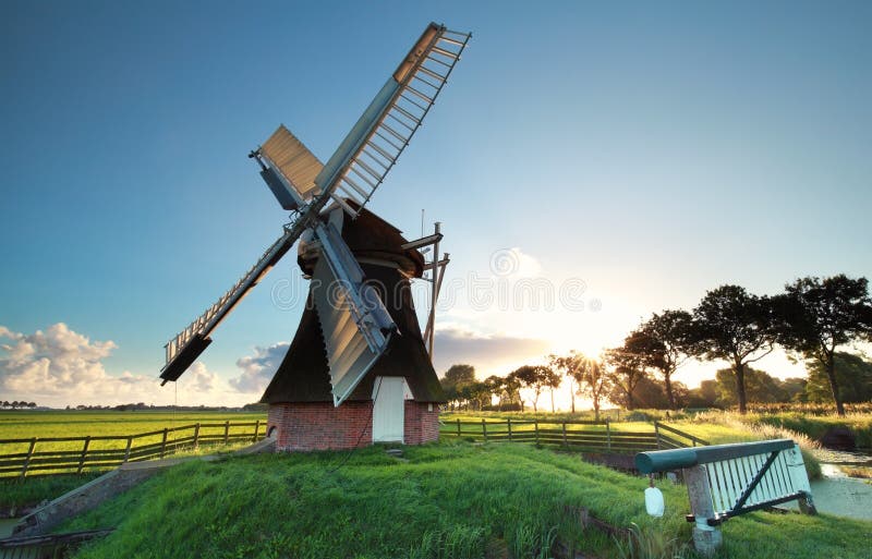 Windmill at Sunrise stock photo. Image of close, awesome - 15550702