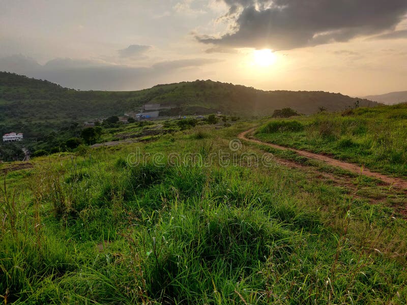 An Old Earthen Road Path Running Beyond the Hills Stock Photo - Image ...