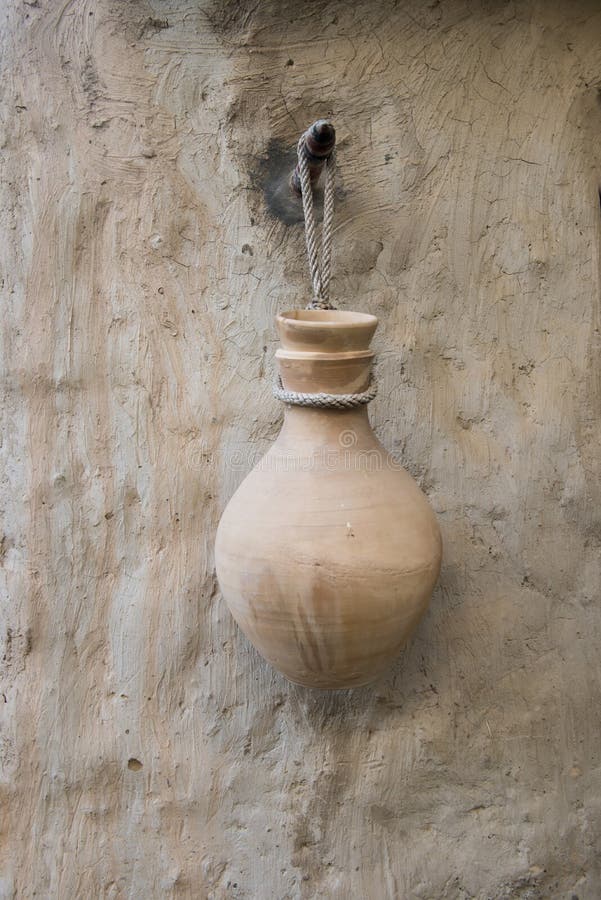 Old Earthen Water Container Stock Photo - Image of building, dispenser ...