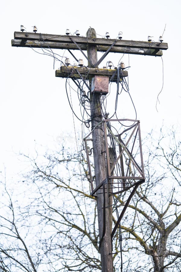 An Old Electric Pole with Many Broken Wires is Abandoned Stock Photo ...