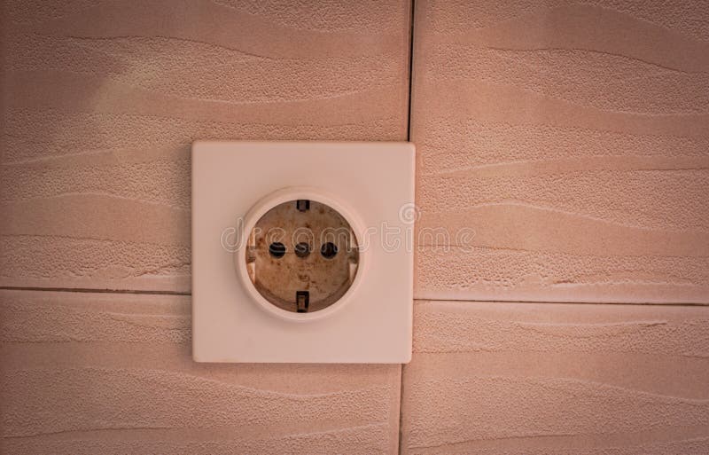 Old burnt plug in a wall stock photo. Image of overload - 50536340
