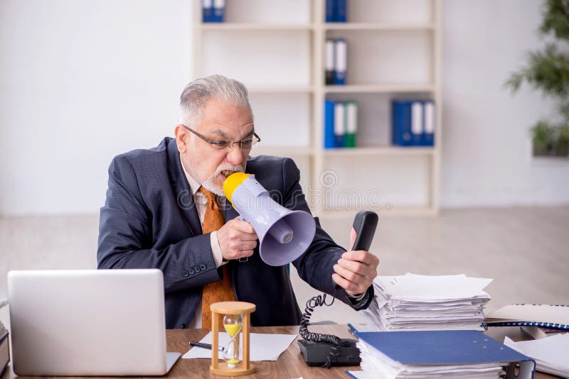 Old Male Employee Holding Megaphone at Workplace Stock Image - Image of ...