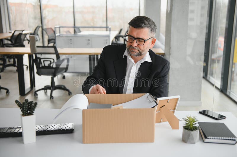 Old Employee Leaving Office with the Box Full of Belongings Stock Photo ...