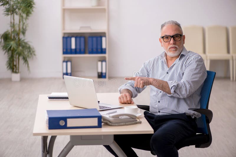 Old Male Employee Working at Workplace Stock Photo - Image of ...