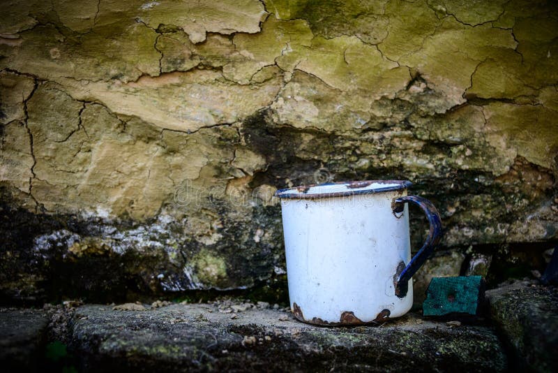 Old enamelware mug stock image. Image of battered, country - 37747345
