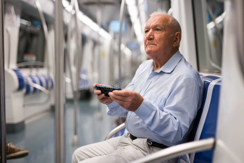 Old Man with Smartphone Sitting Inside Subway Train Stock Image - Image ...