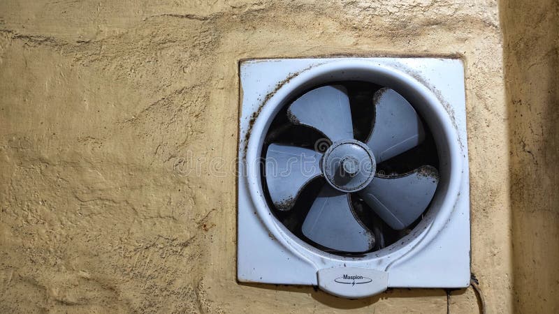 Old Exhaust Fan Mounted on a Textured Yellow Wall. Stock Photo - Image ...