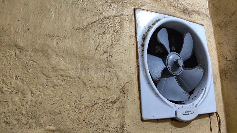 Old Exhaust Fan Mounted on a Textured Yellow Wall. Stock Photo - Image ...