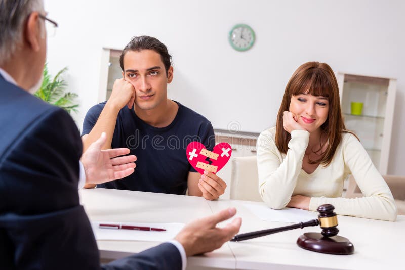 Old Experienced Judge and Young Couple in Divorcing Concept Stock Photo ...