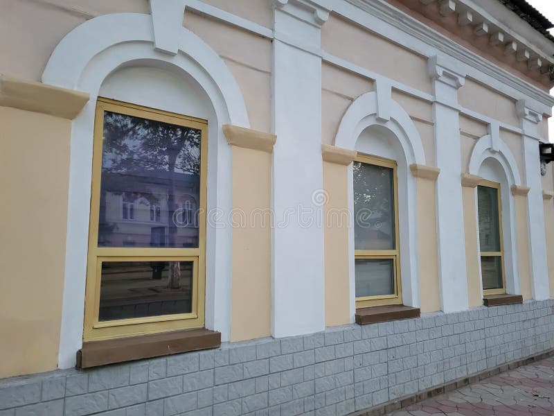 The Old Facade of the House with Windows and Arches. Stock Photo ...