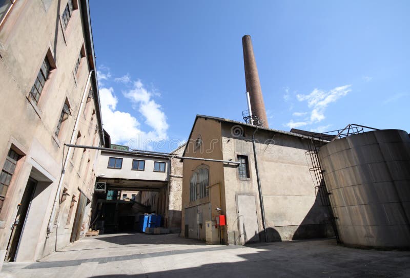 Old factory courtyard stock image. Image of machinery - 19895439