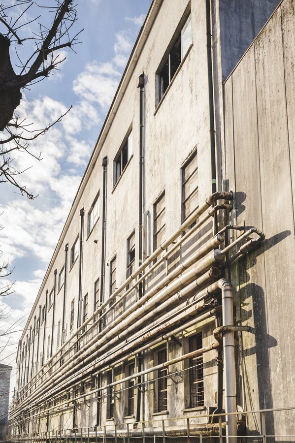 Old factory and pipes stock photo. Image of metallic - 65423704