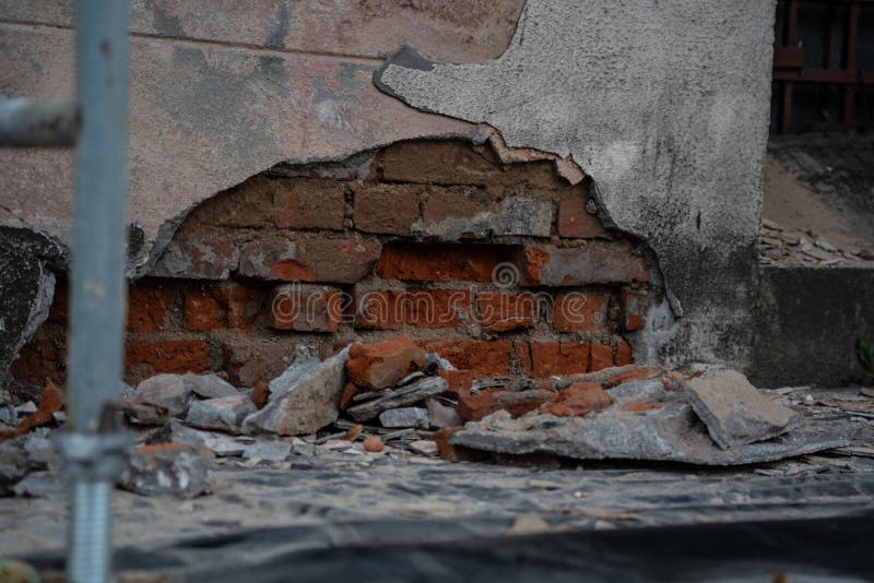 Old, Fallen-off Plaster from a Brick Building. Red Brick Behind the ...