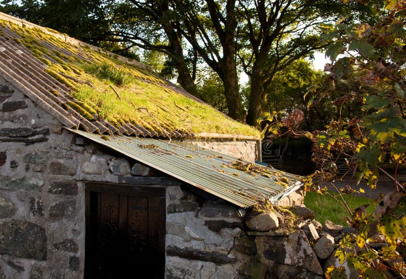 Old Farm Building with Moss Covered Roof Stock Photo - Image of stone ...