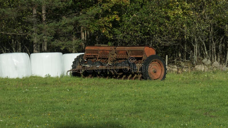 Old Farm Machine on the Edge of a Farm Field Stock Photo - Image of ...