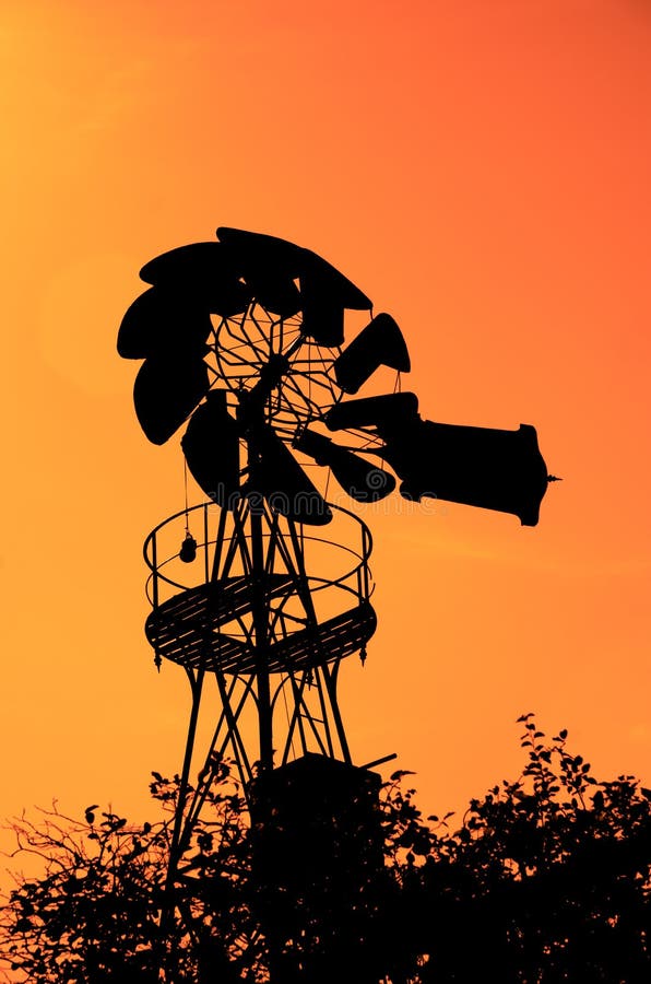 Old Farm Windmill stock image. Image of sunset, vane - 21455199