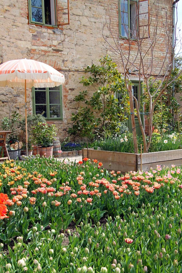 An Old Farmhouse with a Flower Garden in Front of it. Stock Image ...