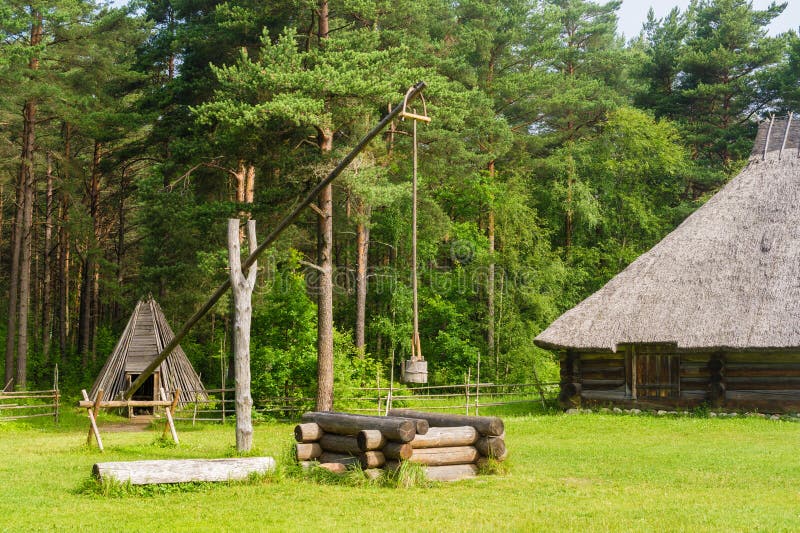 Old farmhouse with a well stock image. Image of building - 70153765