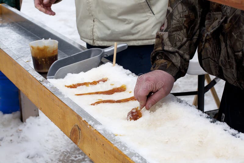 Old Fashion Maple Taffy on Snow Stock Image - Image of canadian, gooey ...