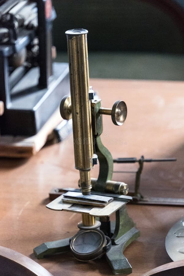An old fashion microscope. stock photo. Image of room - 356978738