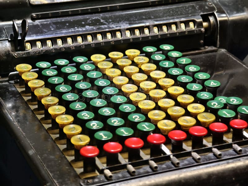 An Old Fashioned Adding Machine Features a Drawer Located Underneath it ...