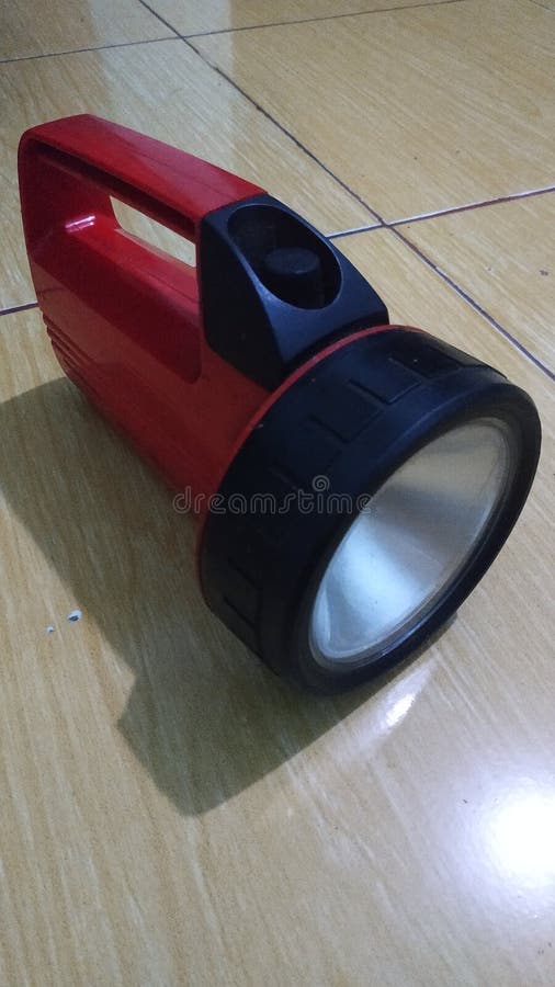 Old Fashioned Big Red and Black Flashlight with Big Battery Stone Stock ...