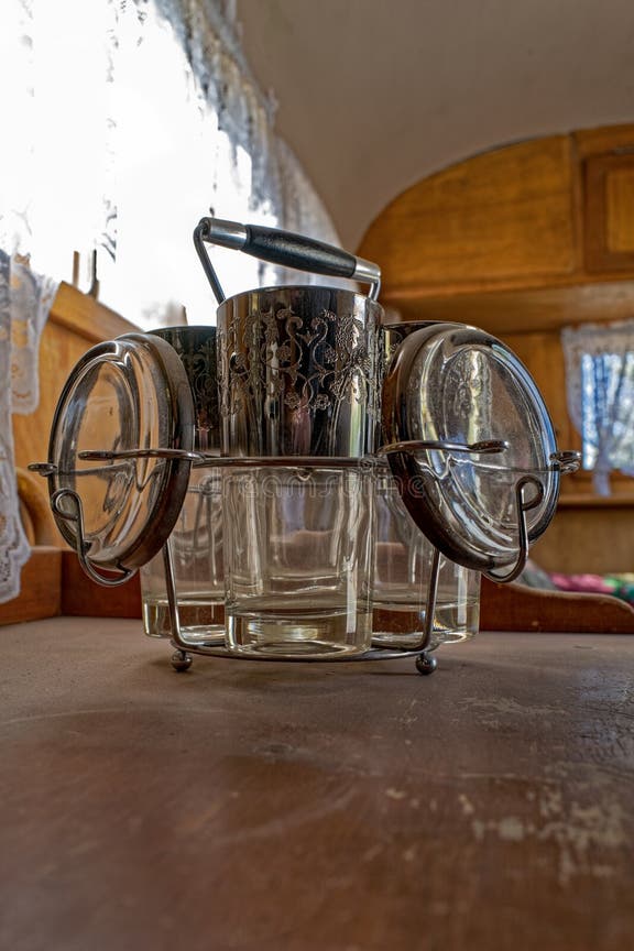 An Old Fashioned Caddy of Cocktail Glasses and Coasters Stock Photo ...