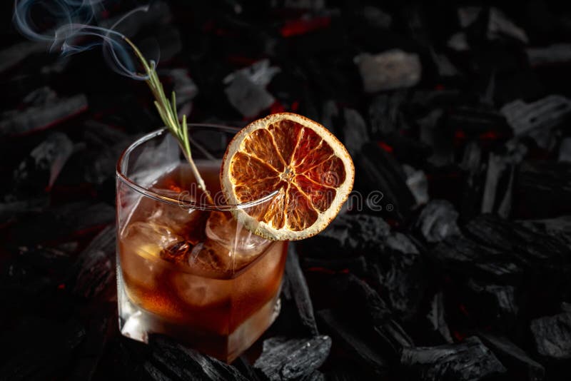 Old Fashioned Cocktail With Ice Dried Orange Slice And Rosemary Stock